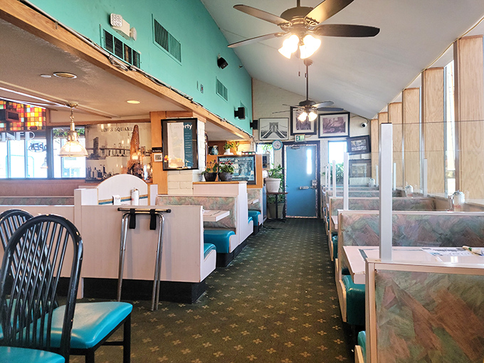 The classic diner layout – where every booth has witnessed first dates, family reunions, and countless "just one more coffee" moments.