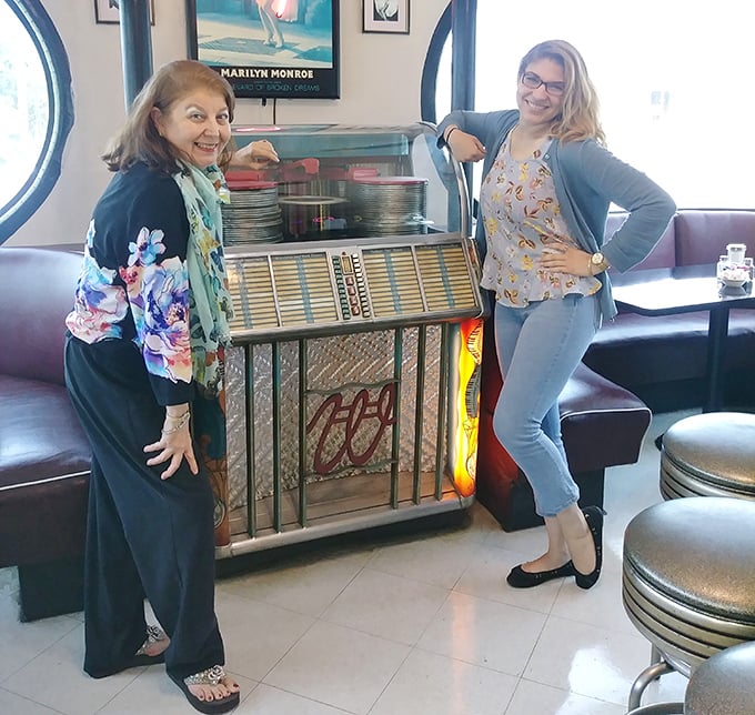 The vintage jukebox stands as a musical time capsule, ready to provide the soundtrack to your meal for just a quarter.