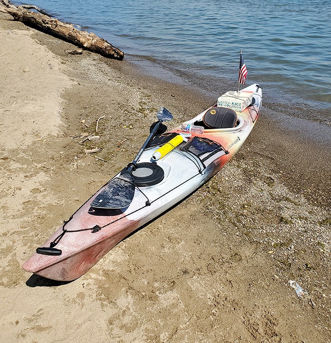 A lone kayak waits for its next adventure, promising intimate explorations of Lake Erie's shoreline that motorized vessels simply can't provide.