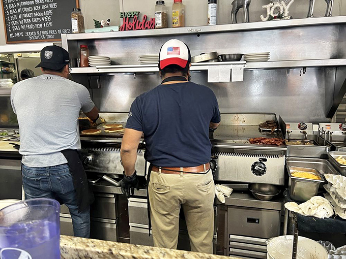 Behind the scenes, the kitchen crew orchestrates breakfast magic with the practiced efficiency of people who've flipped more eggs than most of us have had hot dinners.