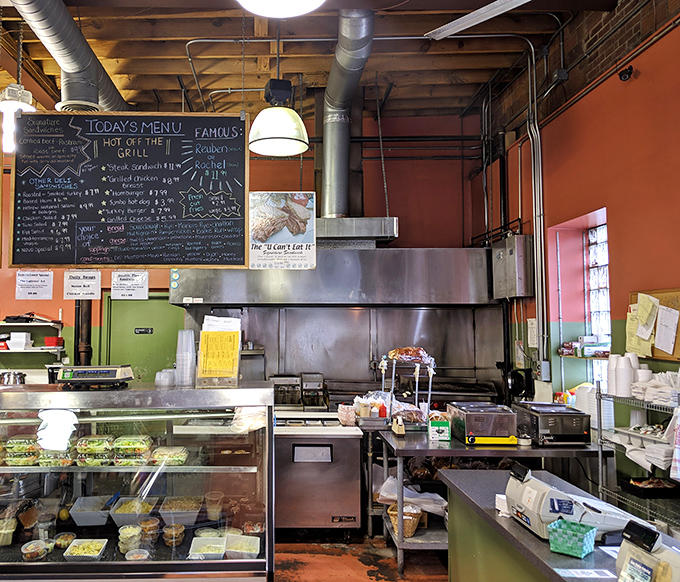 The open kitchen layout lets you witness sandwich artistry in action. Like watching Picasso, if Picasso worked with pastrami instead of paint.