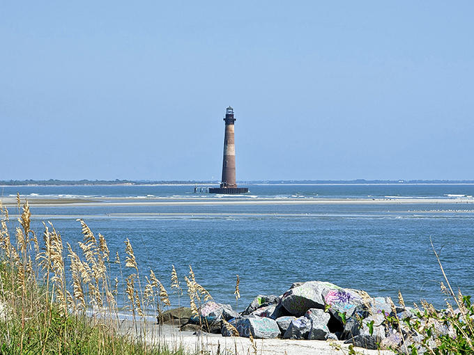 Morris Island Lighthouse stands like an exclamation point on the horizon, punctuating Folly's dramatic coastal narrative.