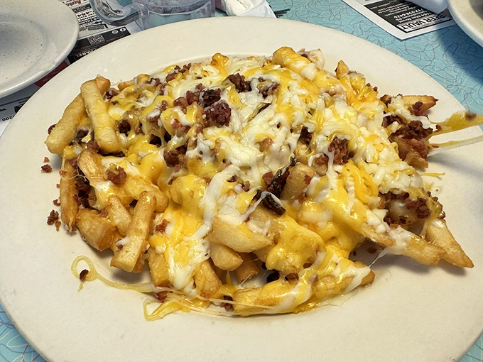 Loaded fries that laugh in the face of diet plans. The cheese-to-bacon ratio achieves that perfect golden balance that makes sharing nearly impossible.