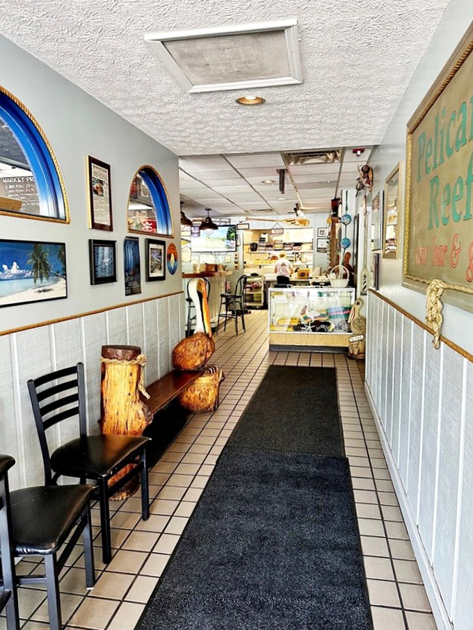 The entrance hallway sets the coastal mood with its wainscoting and maritime decor. That black runner has guided countless seafood pilgrims.