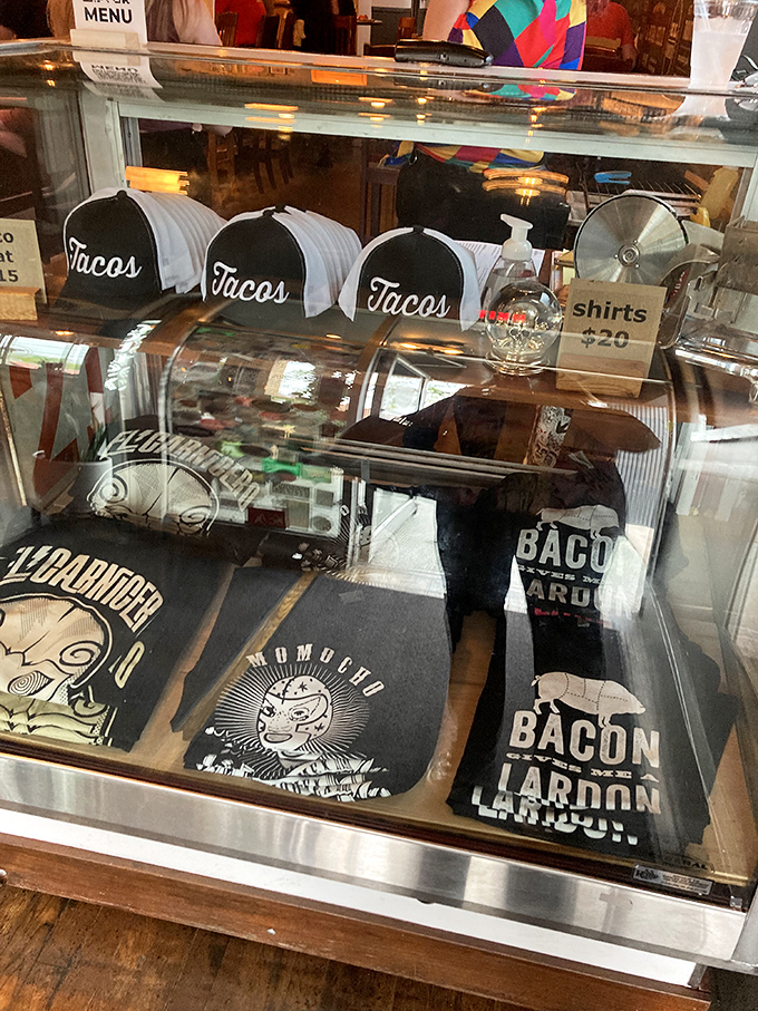 Even the merch display shows personality&mdash;because nothing says "I had an amazing meal" like a taco hat souvenir.