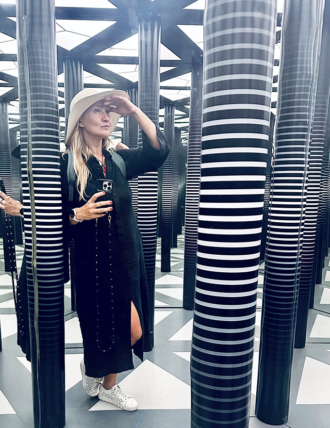The striped column maze creates disorienting pathways where visitors lose all sense of direction while hunting for the perfect selfie spot.