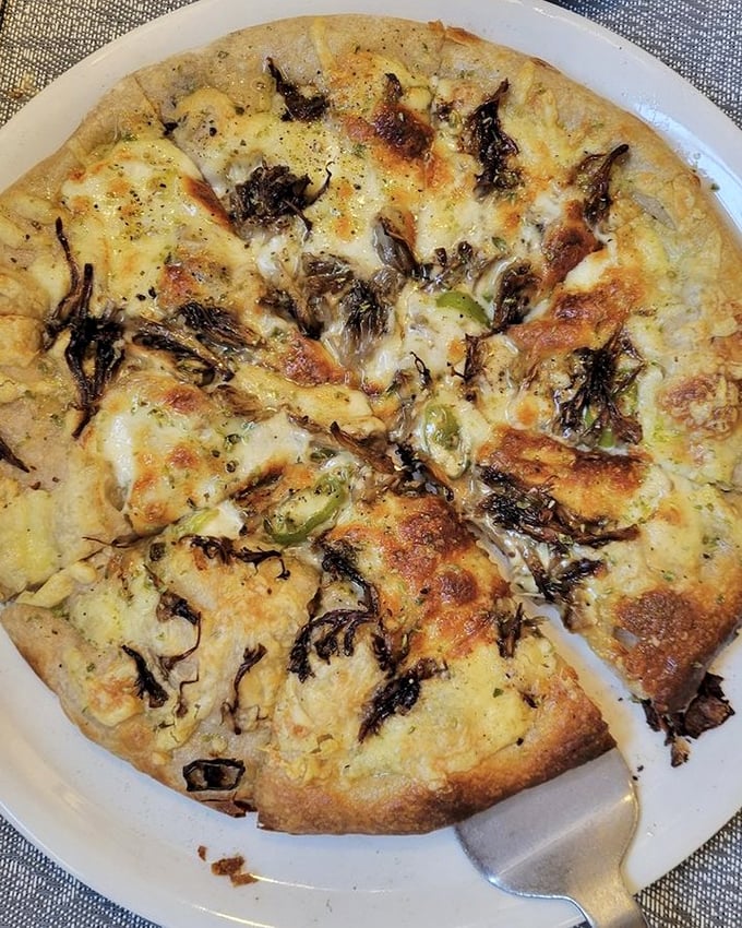 A mushroom pizza that makes you question why you ever ordered pepperoni. Earthy, cheesy, and worth every carb-laden bite.