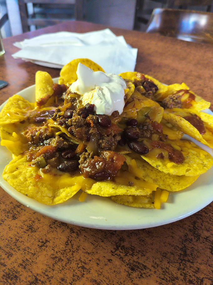 Nachos that don't come from a heat lamp purgatory, but from people who understand proper cheese-to-chip distribution.