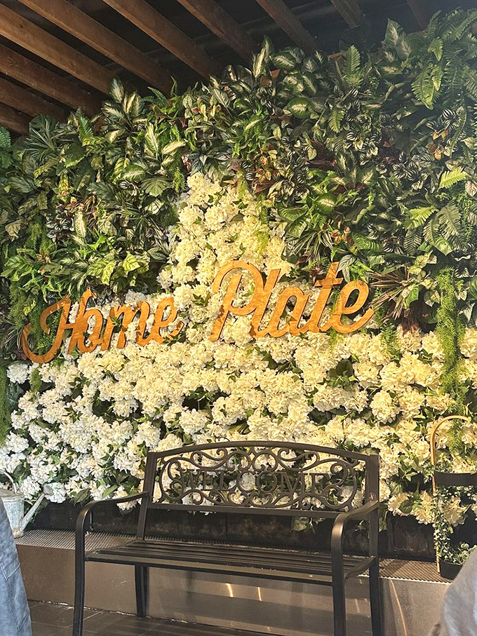 A lush green wall with the Home Plate name in golden letters&mdash;like Mother Nature herself is endorsing your breakfast choice.