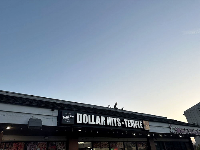 The Dollar Hits sign glows like a beacon for hungry souls seeking authentic Filipino flavors in the heart of Los Angeles.