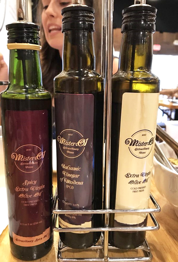 These aren't just condiments&mdash;they're liquid gold. The holy trinity of oils and vinegar that transforms good bread into an out-of-body experience.