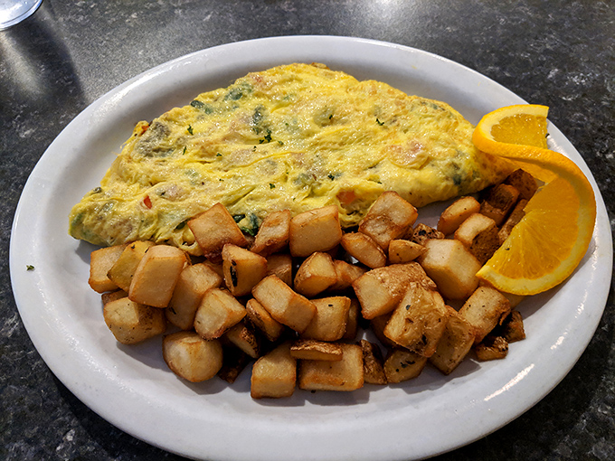 Eggs Benedict elevated with crab cakes instead of Canadian bacon. That hollandaise sauce cascading down like a yellow waterfall of happiness.