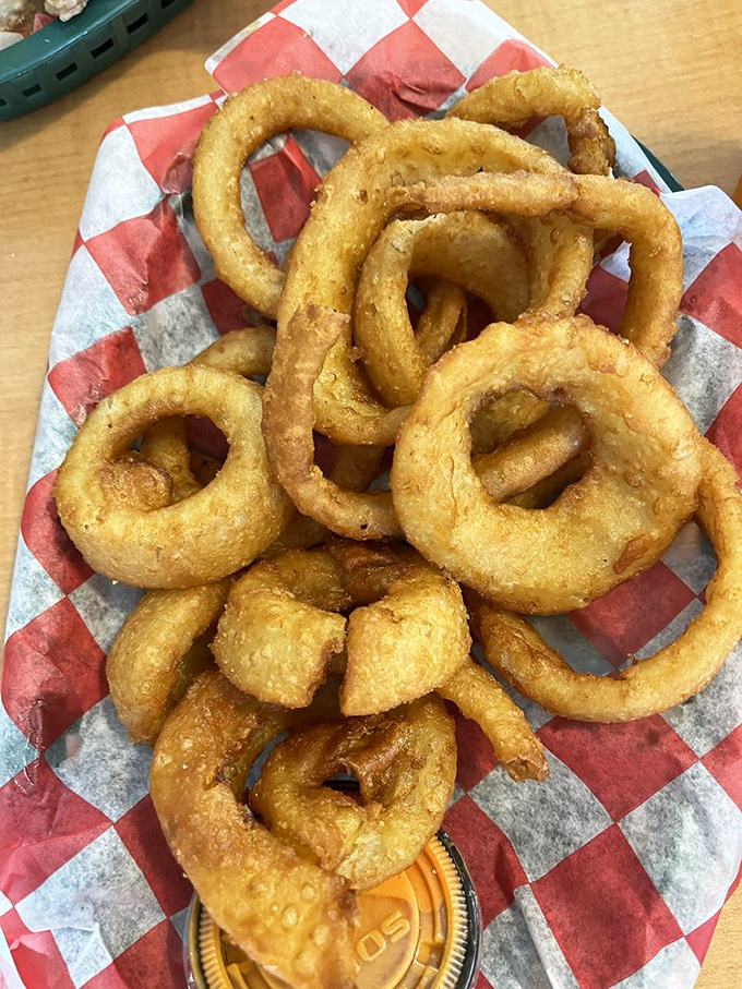 Onion rings with the perfect crunch-to-softness ratio. These golden halos aren't sides&mdash;they're main attractions that happen to accompany sandwiches.