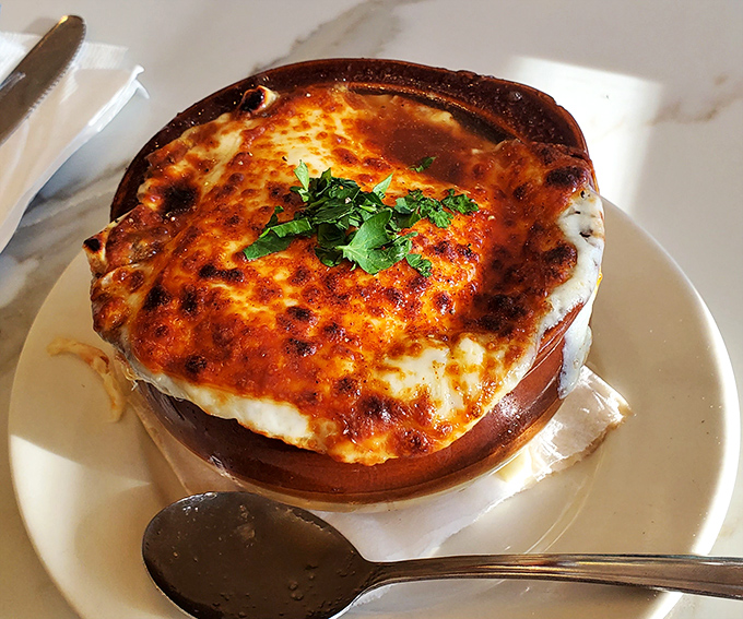 This bubbling crock of French onion soup has achieved that perfect cheese-to-soup ratio that food scientists have been chasing for centuries.