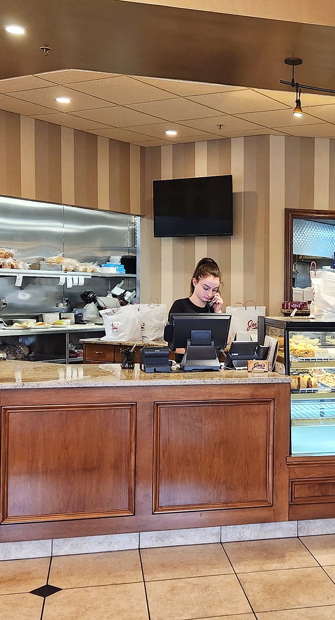 At the order counter, the daily dance of hospitality unfolds, where every sandwich request begins its journey to delicious fulfillment.