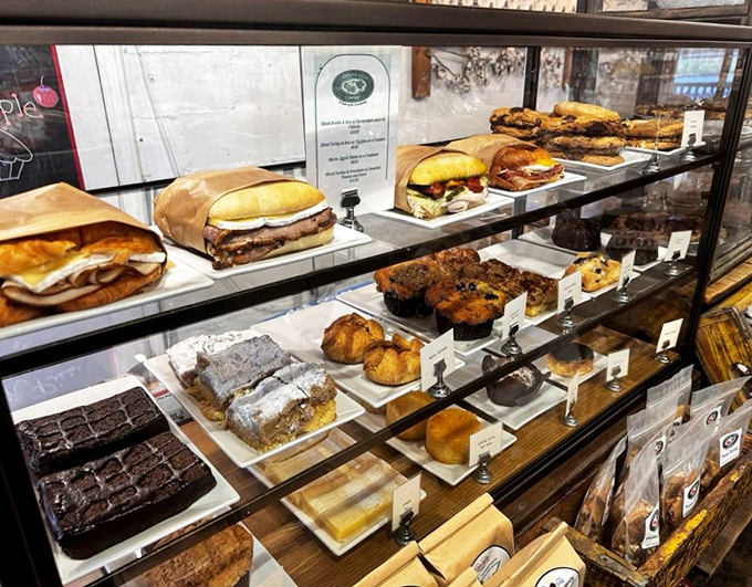 The display case doesn't just hold pastries – it showcases edible artwork that makes choosing just one feel like Sophie's Choice for your sweet tooth.