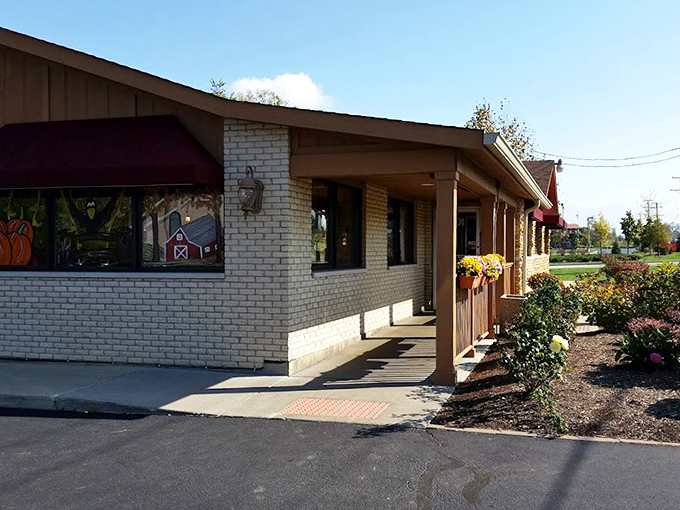Seasonal flowers frame the entrance like nature's welcome committee. Even the landscaping seems to say, "You're going to leave here happier than you arrived."