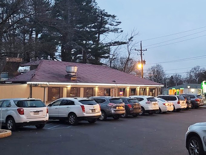 As dusk settles, the diner's lights beckon hungry travelers like a culinary lighthouse guiding you safely to port.