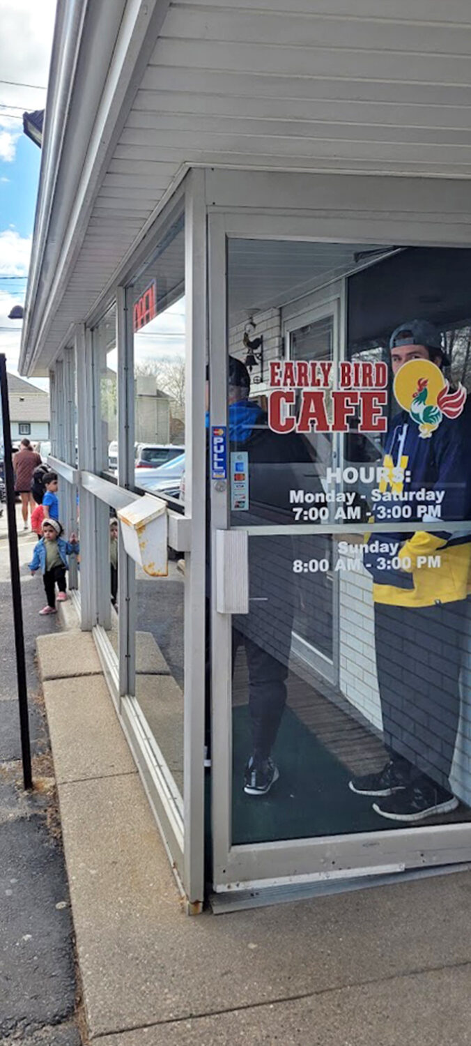 The welcoming entrance with hours posted &ndash; your portal to breakfast nirvana opens bright and early for the hungry masses.