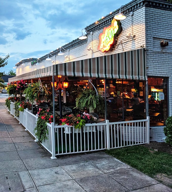 As evening approaches, Kelly's exterior glows with warmth, the neon sign beckoning hungry patrons like a lighthouse for comfort food seekers.