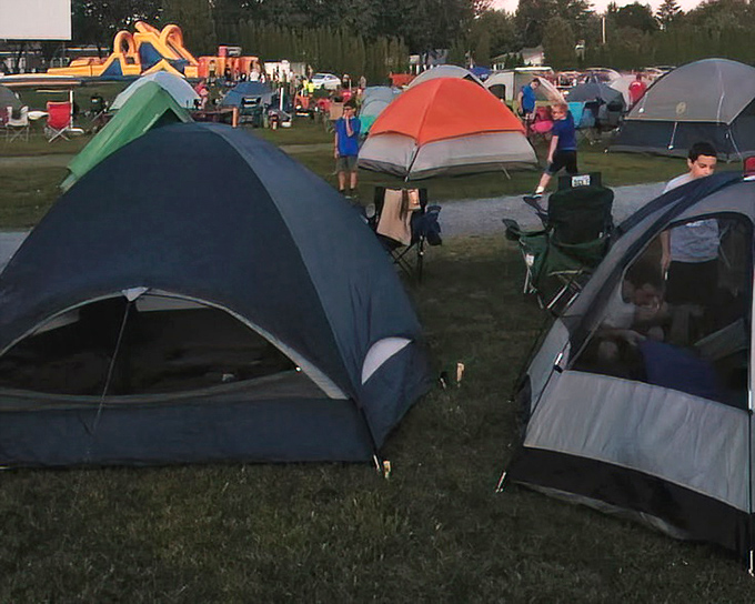 Movie night becomes camping night! Some patrons bring tents for the full outdoor experience. S'mores and scary movies—a combination approved by campfire storytellers everywhere.