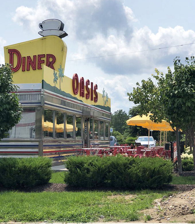 The iconic Oasis sign stands proud against Indiana skies, a landmark that's witnessed countless road trips and homecomings.