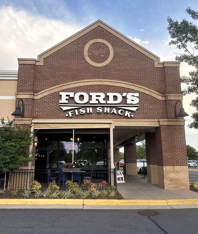 White rocking chairs line the entrance like sentinels of Southern hospitality, inviting you to sit a spell before diving into seafood treasures within.