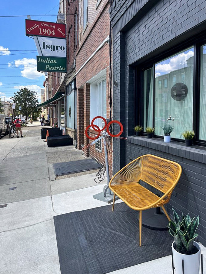 The sidewalk outside Isgro's&mdash;where the anticipation of what's inside makes even this yellow chair look like a VIP waiting area.