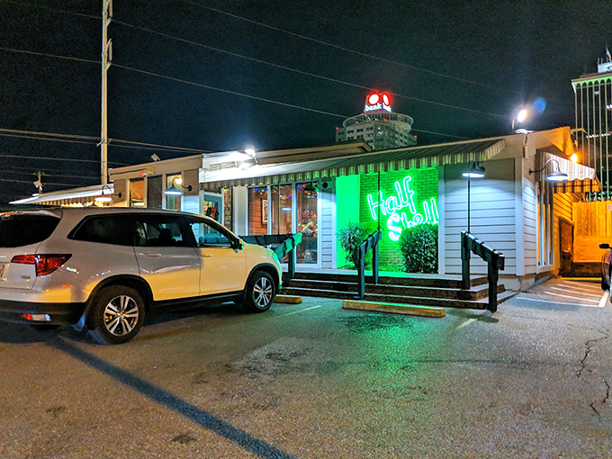 At night, Half Shell's neon glow serves as a lighthouse for hungry travelers navigating the Memphis dining scene in search of seafood salvation.