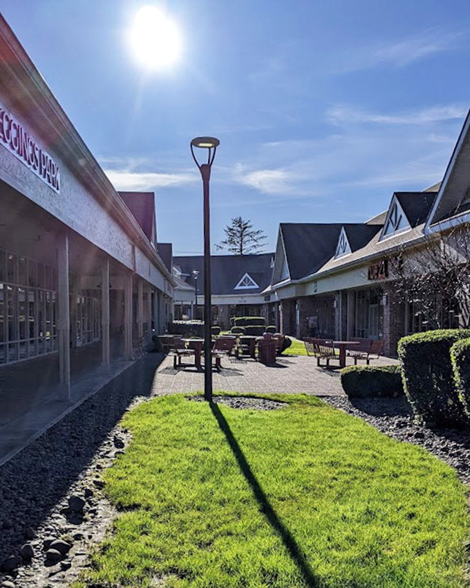 Sun-dappled walkways connect storefronts in this open-air shopping experience, where Oregon's natural beauty complements the retail therapy.