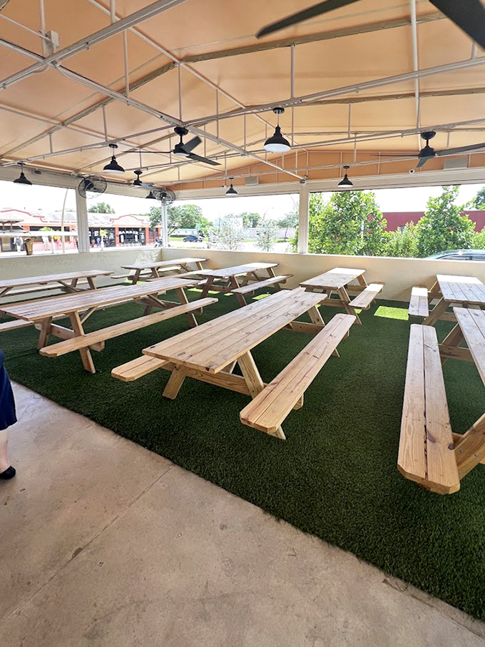 Picnic tables under cover—because Florida weather is as unpredictable as life, but good barbecue is a constant you can count on.