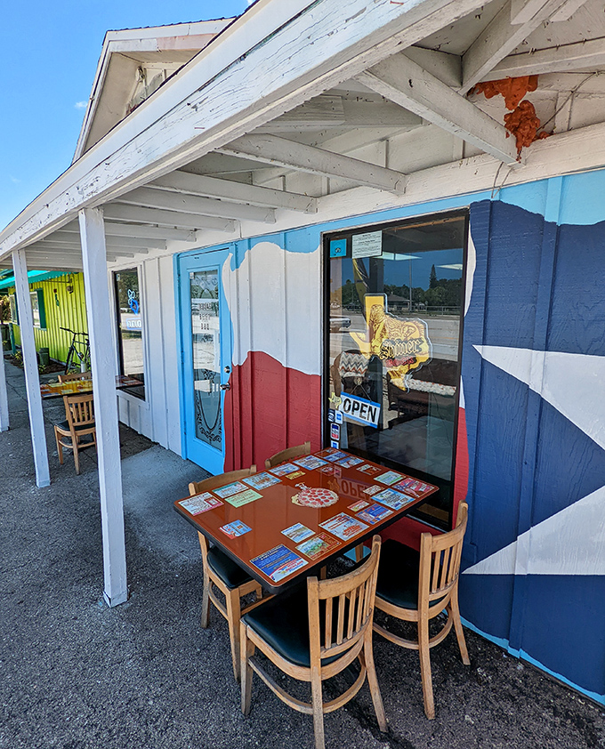 Outdoor seating painted with Texas pride. When the weather's right, there's nothing better than BBQ with a side of fresh air.