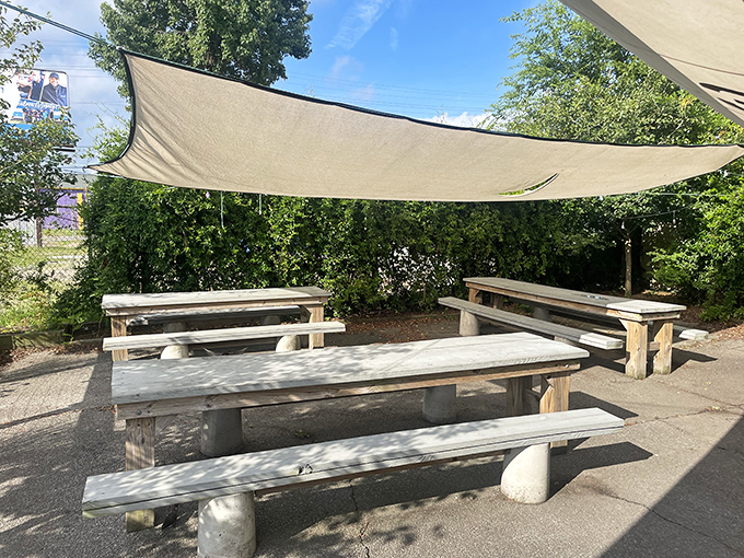 The outdoor seating area offers a shaded sanctuary for biscuit enjoyment. These benches have witnessed countless food epiphanies.