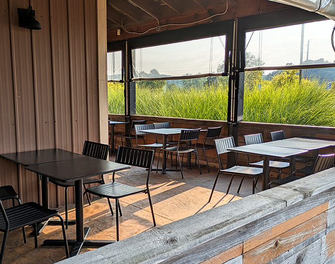 Sunlight streams through windows into this screened sanctuary where summer breezes complement every bite without the bugs.