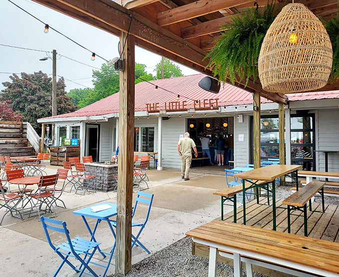 The outdoor seating area, with its mix of blue tables and rustic benches, is where summer memories are made, one bite at a time.