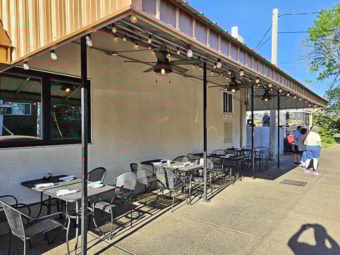 Al fresco dining with string lights overhead&mdash;because pasta tastes even better with a side of fresh air and people-watching.