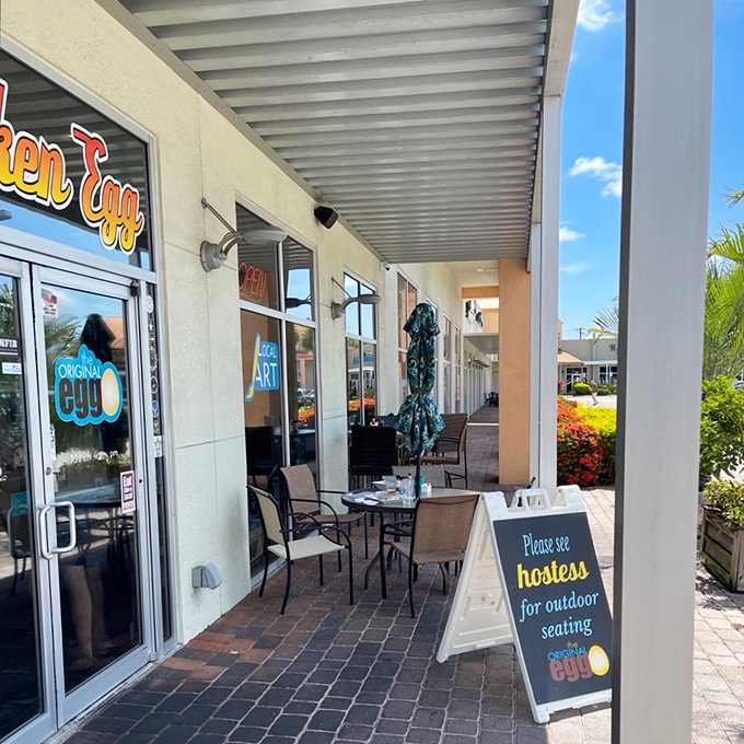 Outdoor seating for those who like their eggs with a side of Florida breeze and people-watching.