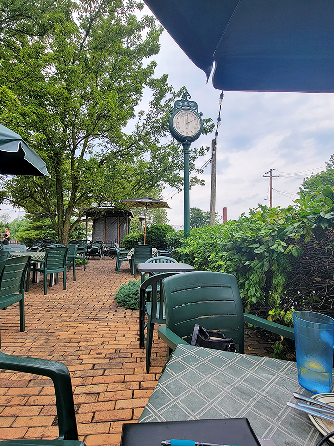 The outdoor patio offers brick-paved charm and a vintage clock that seems to say, "Slow down, savor your meal." Summer dining perfection awaits.