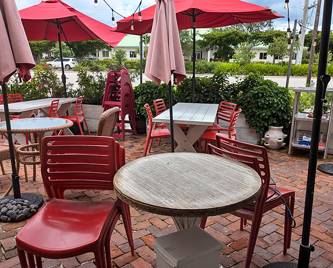 The outdoor seating area&mdash;where Florida's perfect weather meets The Rooster's perfect food. Those red chairs have witnessed countless food epiphanies.