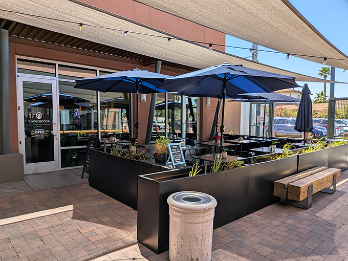The outdoor patio with blue umbrellas offers a perfect Arizona morning experience. Breakfast al fresco is always a good idea in Phoenix.