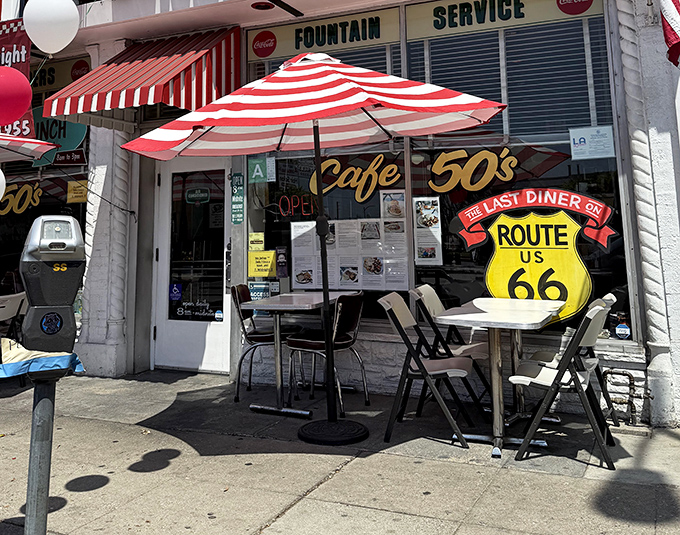 Sidewalk seating that says "California casual" while the Route 66 sign whispers "American classic." Best of both worlds, right outside.