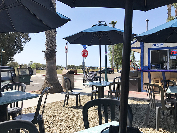 Al fresco dining with a side of California sunshine. These blue umbrellas have sheltered generations of happy eaters from the coastal rays.