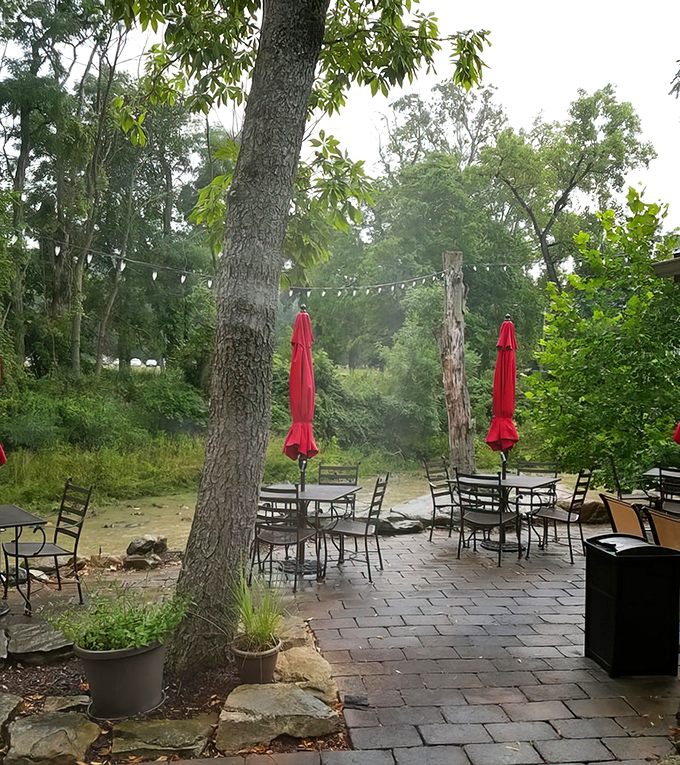 The outdoor patio, where string lights and red umbrellas create an al fresco experience that rivals any big-city restaurant.