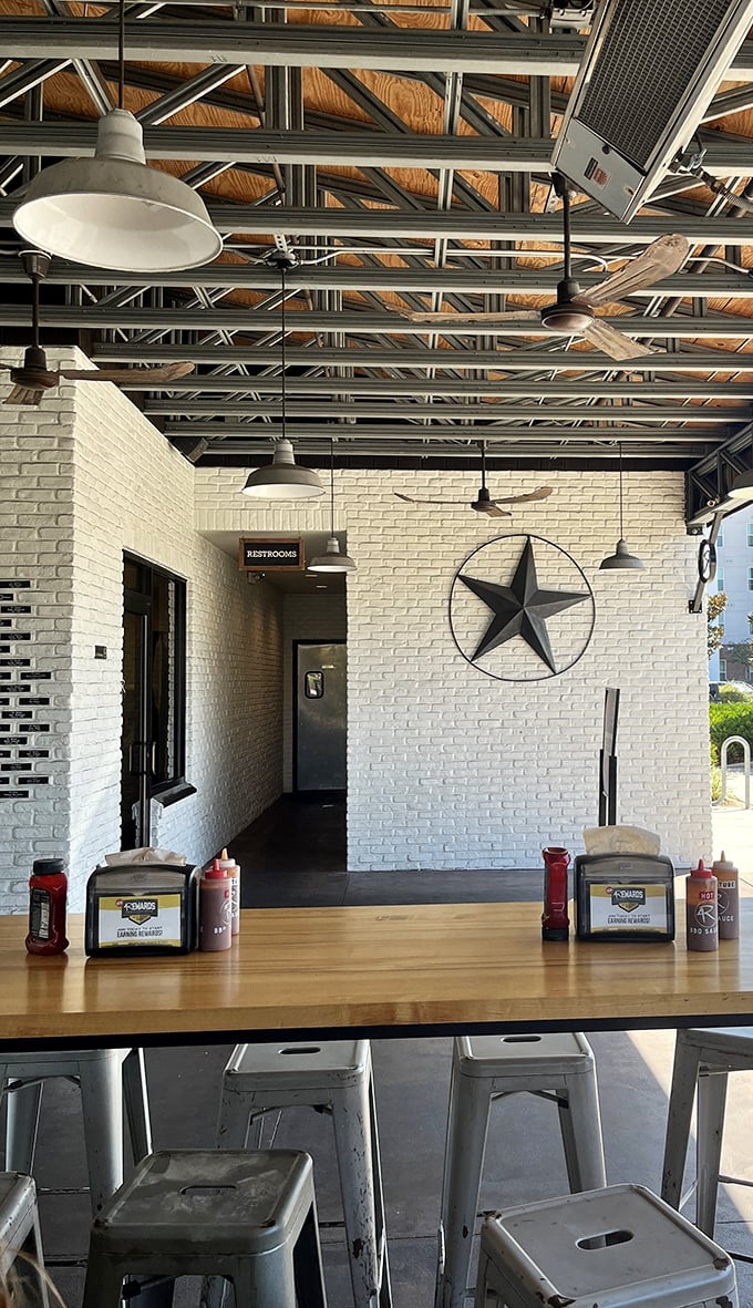 Texas stars and industrial lighting create the perfect backdrop for barbecue contemplation&mdash;because good smoked meat deserves a moment of reflection.