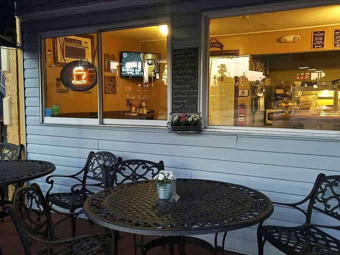 As evening falls, the outdoor seating transforms into the perfect spot for coffee, conversation, and watching the world go by.
