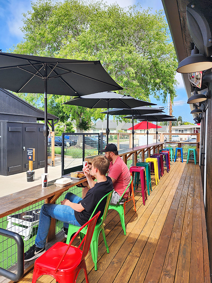 Colorful stools and umbrellas create the perfect outdoor setting for serious meat consumption. California sunshine included at no extra charge.