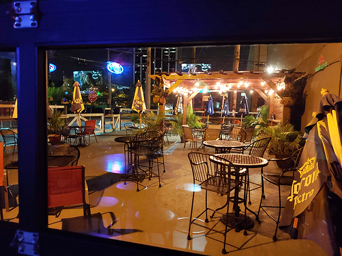 The outdoor patio glows with string lights and possibility. Summer nights were made for pizza al fresco in spaces like this.