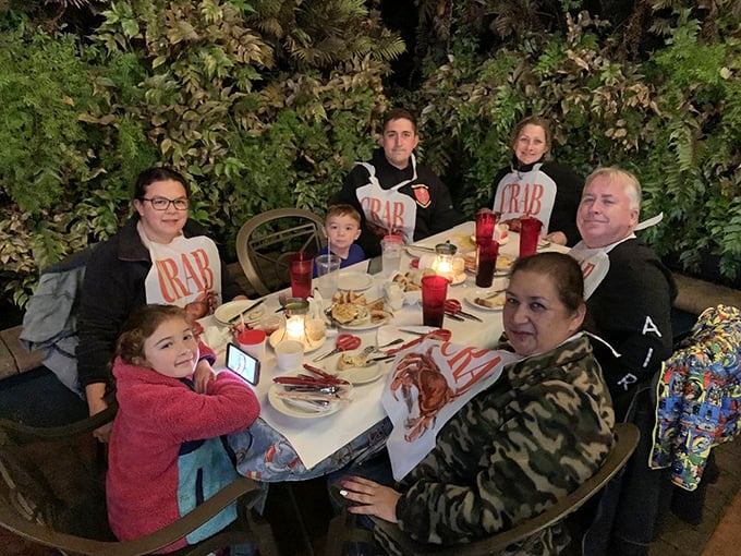 Family-style dining with those signature bibs &ndash; because the best seafood experiences are measured in napkins used and memories made.