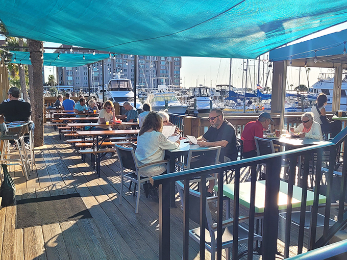 The outdoor deck buzzes with happy diners who've discovered that food always tastes better with a side of boat-watching and sea breeze.