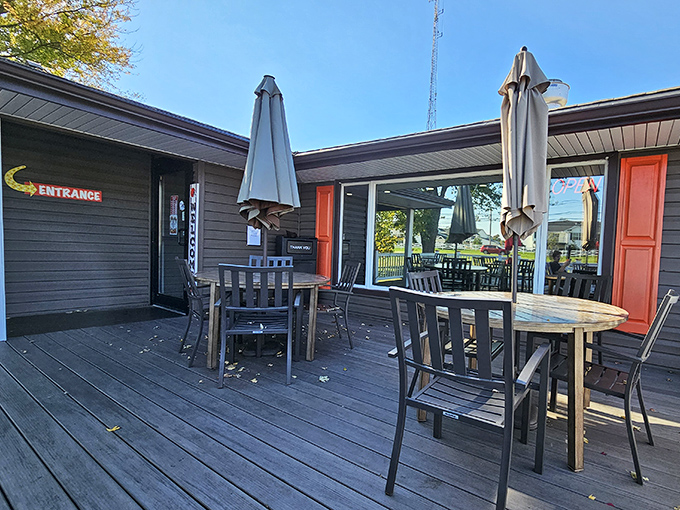 The outdoor deck&mdash;where summer memories are made between bites. Those tables have heard more genuine laughter than most comedy clubs.
